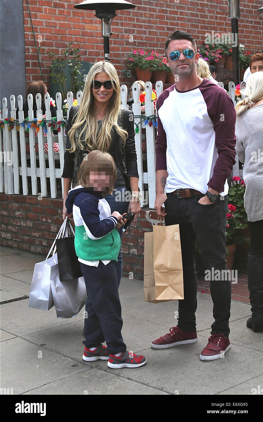 Robbie Keane and Claudine Palmer with their son, Robert Keane Jr, visit ...