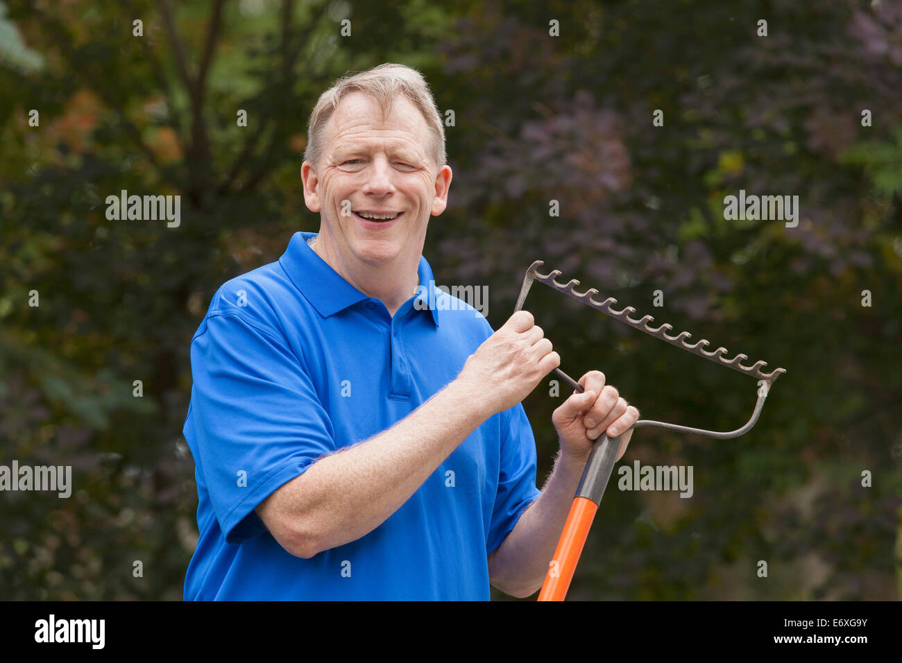 Holding rake hi-res stock photography and images - Alamy