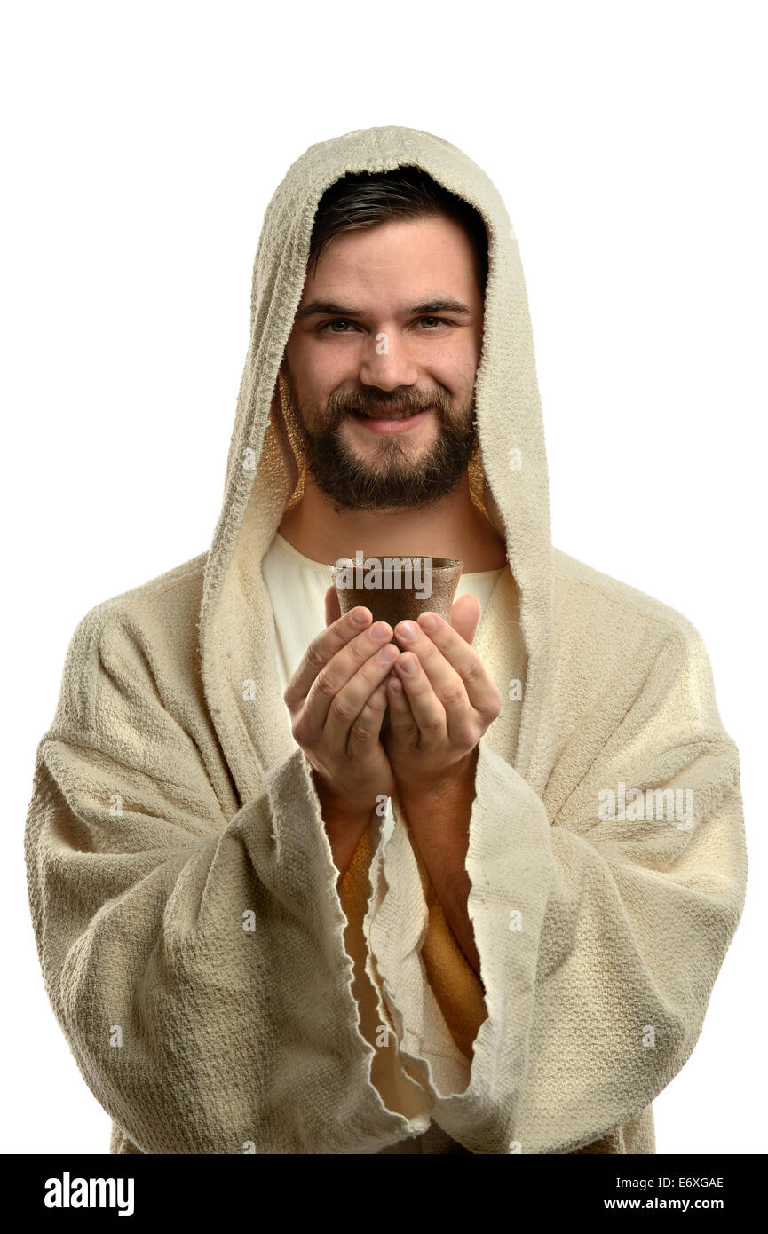 Jesus smiling and holding communion cup isolated over white background ...