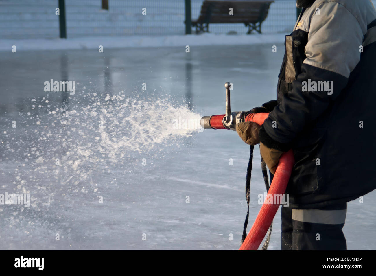 Man with a Water Hose Stock Photo - Alamy