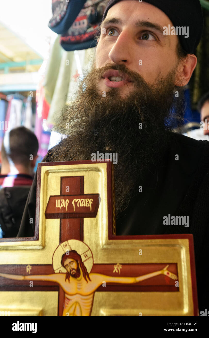 Christian Orthodox monk holds his cross during Good Friday procession ...