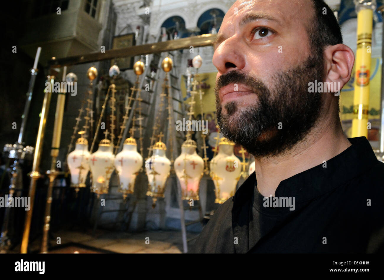 Christian Orthodox priest in the Church of Holy Sepulchre on Good ...