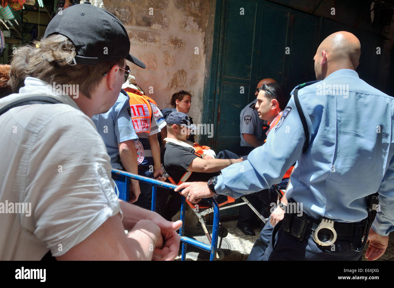 Police provides first aid to their counterpart, who broke his arm in ...