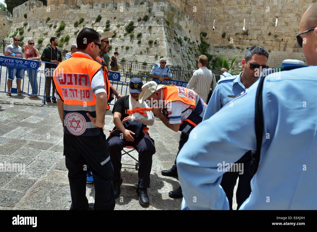 Police provides first aid to their counterpart, who broke his arm in ...