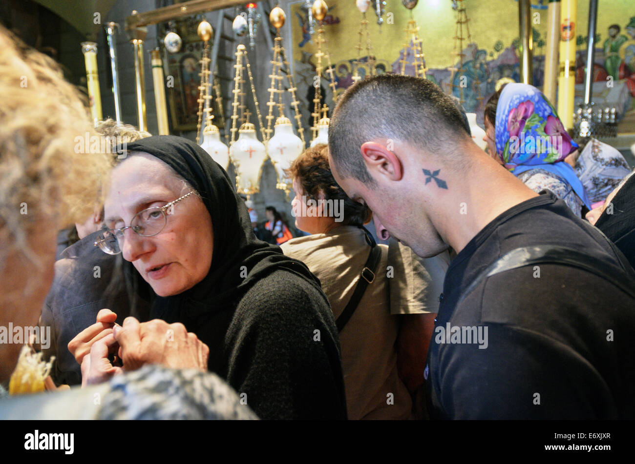 People celebrating Great Saturday inside the Church of the Holy ...