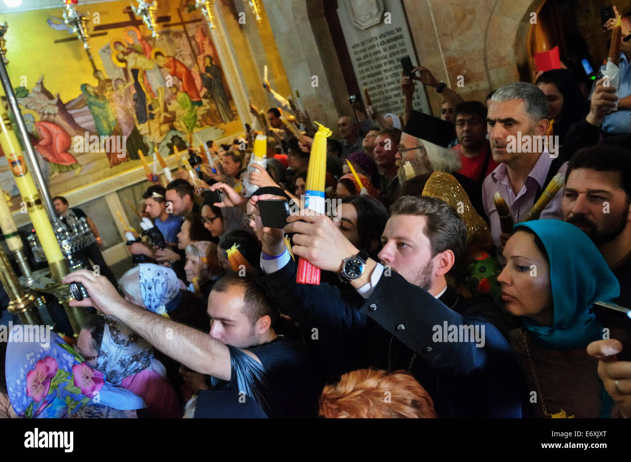 People celebrating Great Saturday inside the Church of the Holy ...