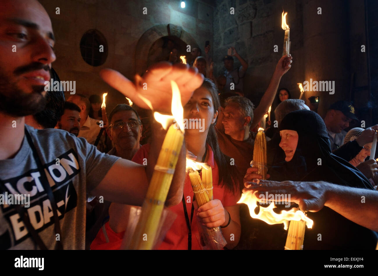 Man touches fire during ceremony of Holy Fire in Holy Sepulcher Church ...