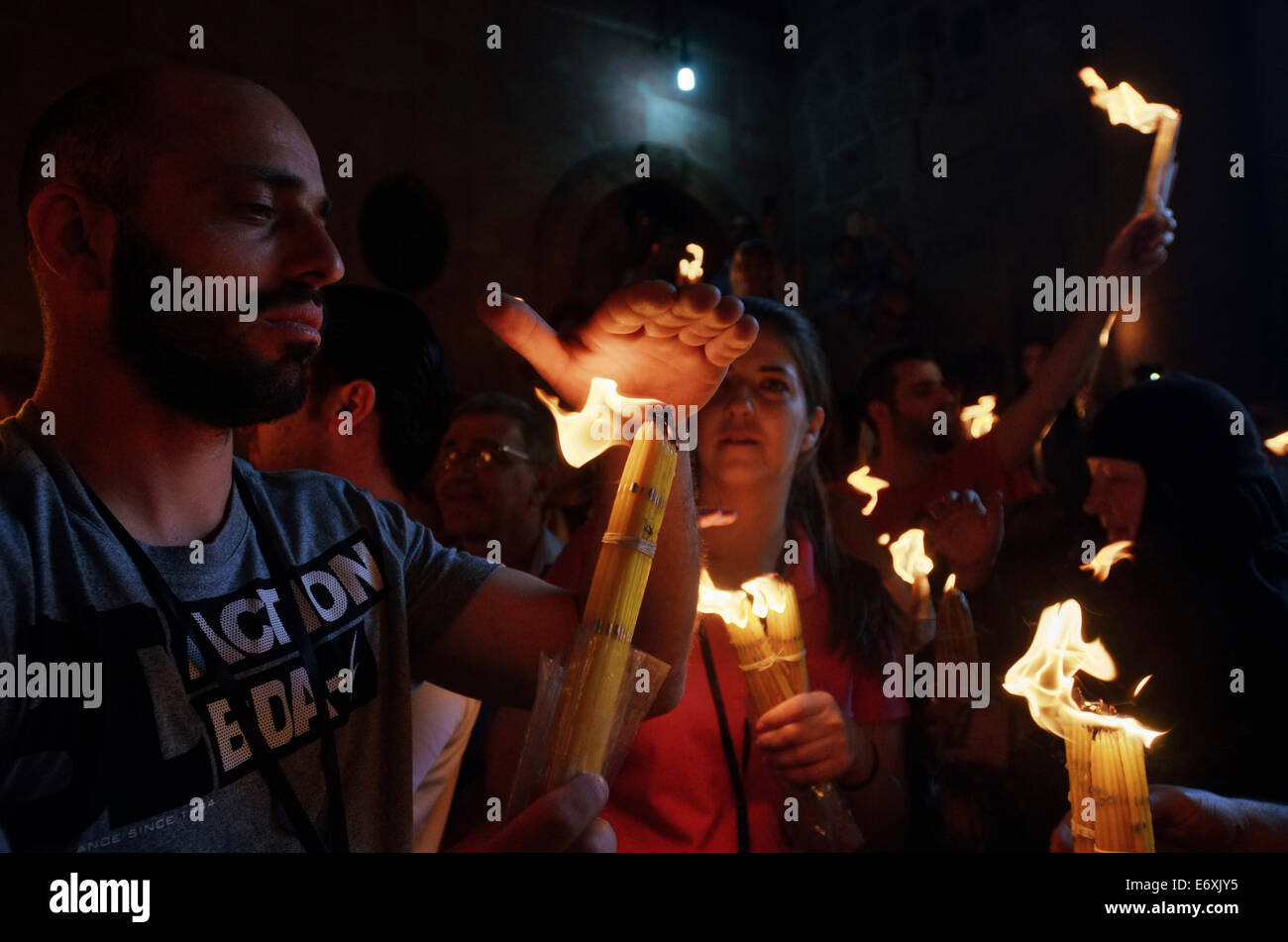 Man touches fire during ceremony of Holy Fire in Holy Sepulcher Church ...