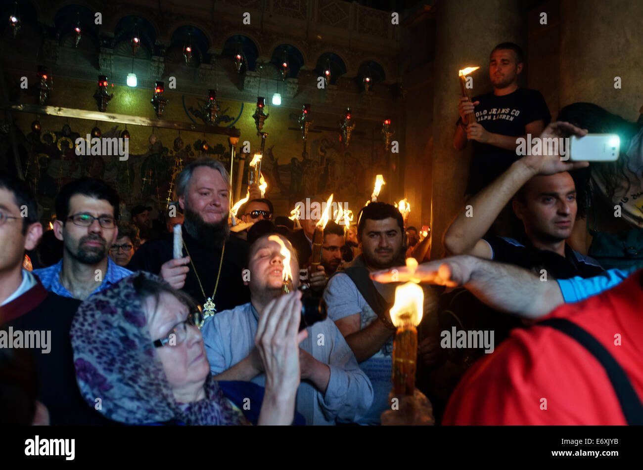 People celebrating Great Saturday inside the Church of the Holy ...