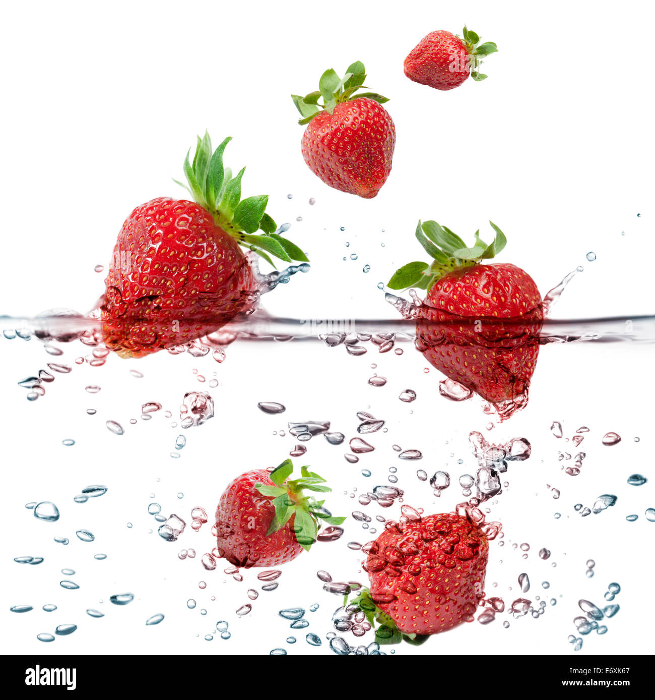 strawberries splash in transparent water, on white background Stock ...