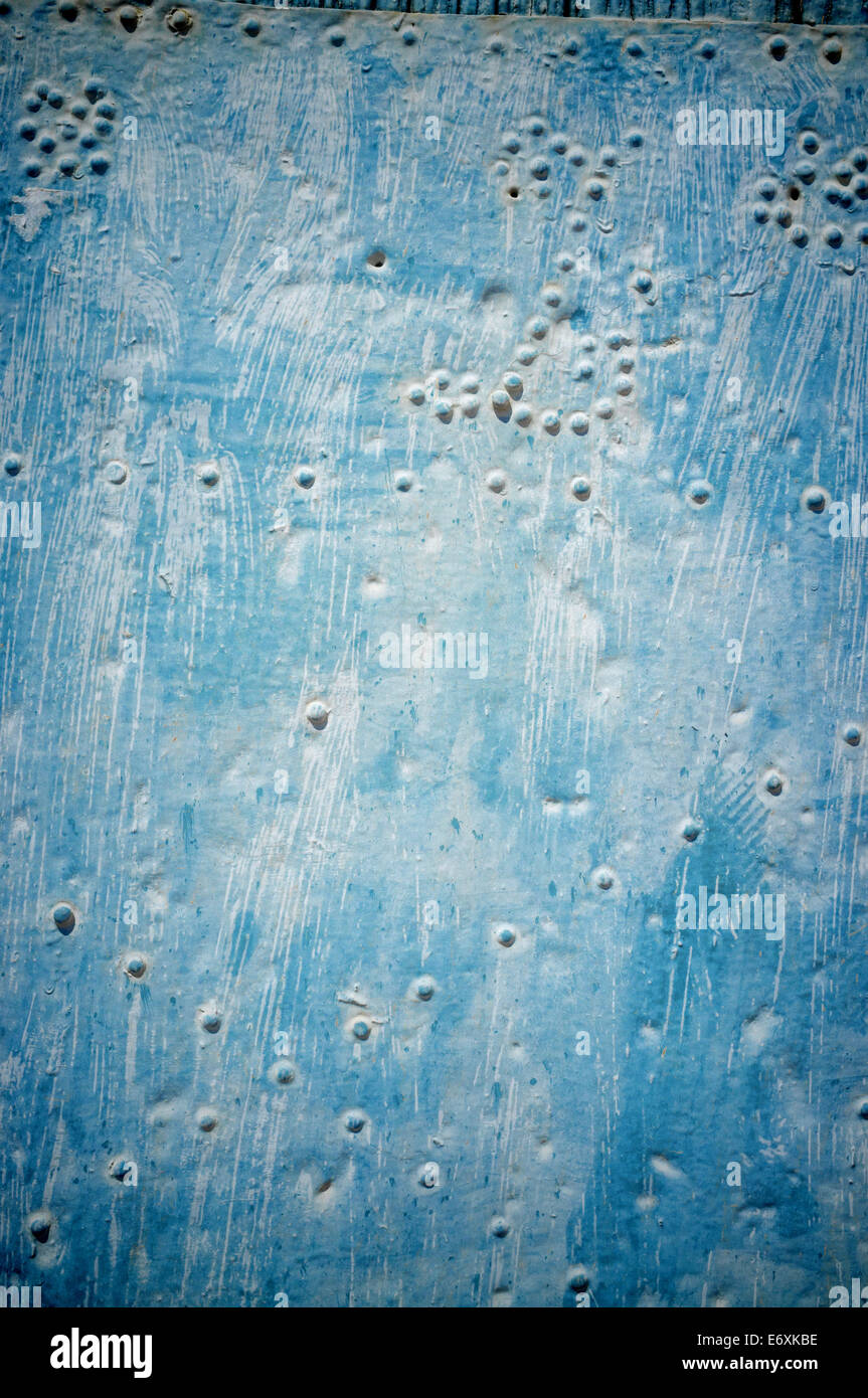 Full frame take of an aged blue metal plate with rivets Stock Photo - Alamy