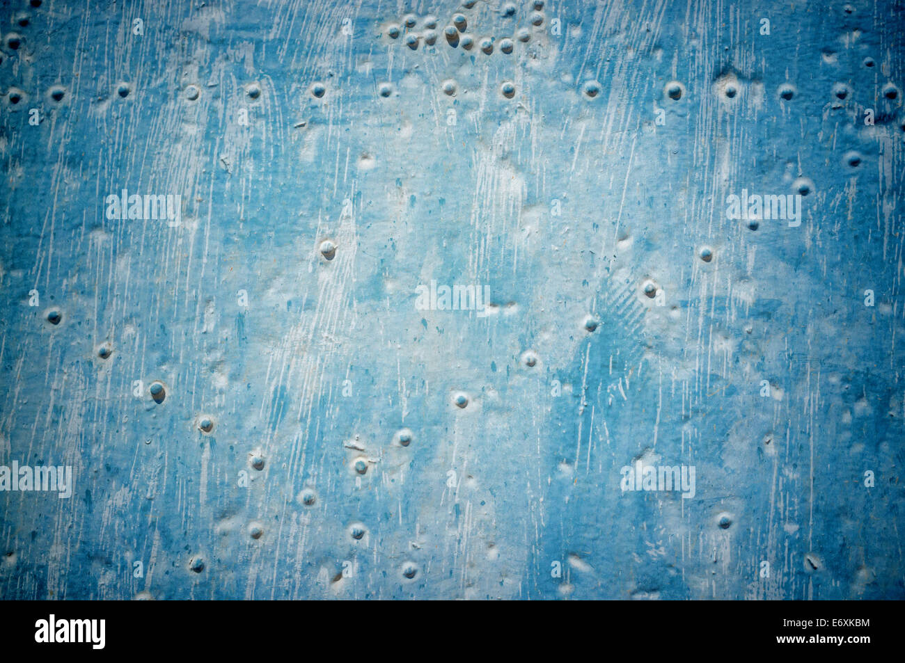 Full frame take of an aged blue metal plate with rivets Stock Photo - Alamy