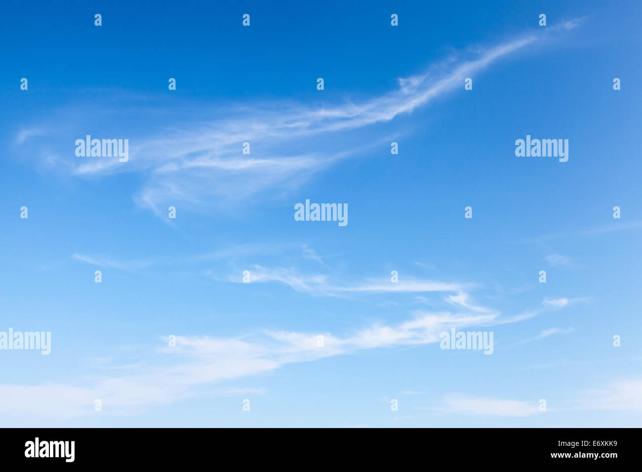 Natural blue windy cloudy sky background texture Stock Photo - Alamy