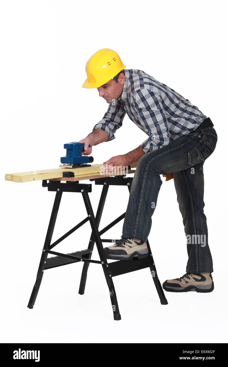 Carpenter using an electric sander Stock Photo - Alamy