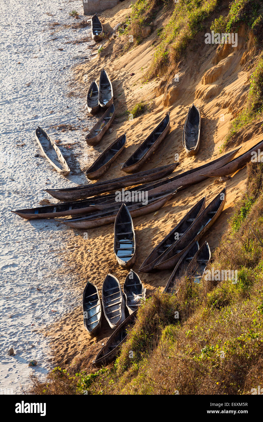 Dug out canoes along the cliffs of tolagnaro hi-res stock photography ...