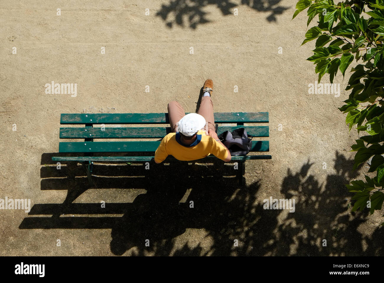 Sitting on park bench hi-res stock photography and images - Alamy
