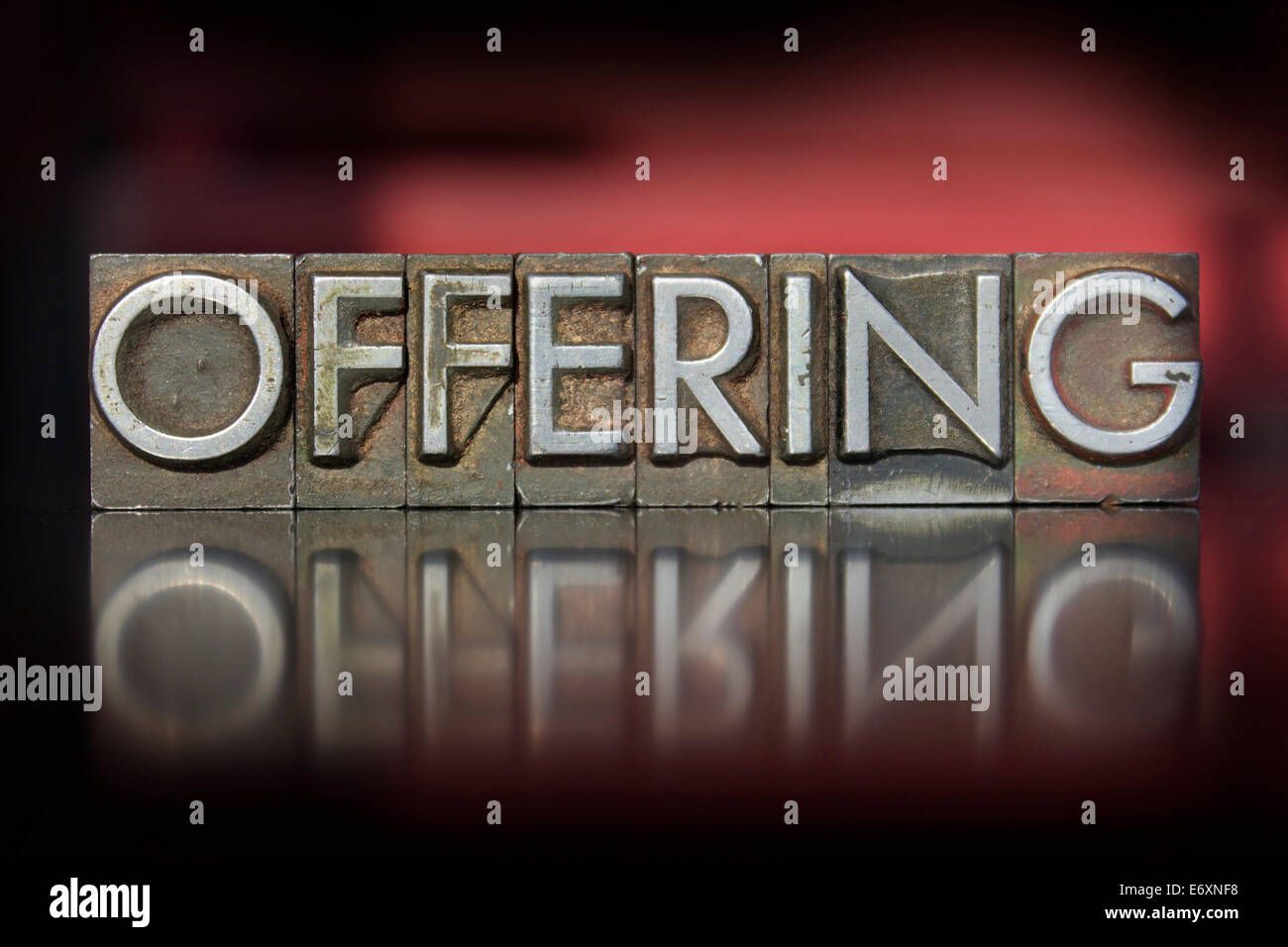 The word Offering written in vintage letterpress type Stock Photo - Alamy