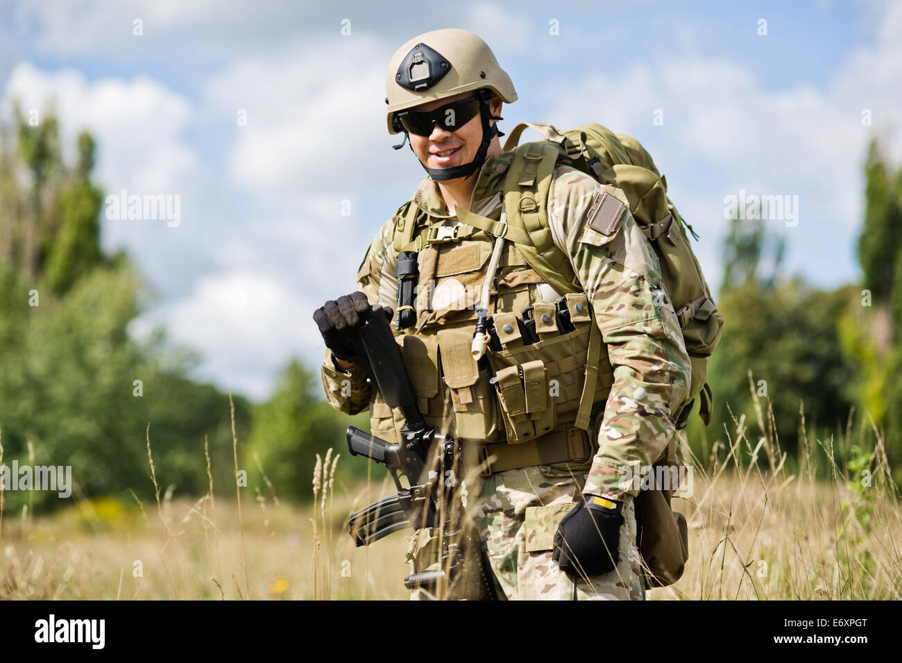 soldiers with weapons posing on rest Stock Photo - Alamy