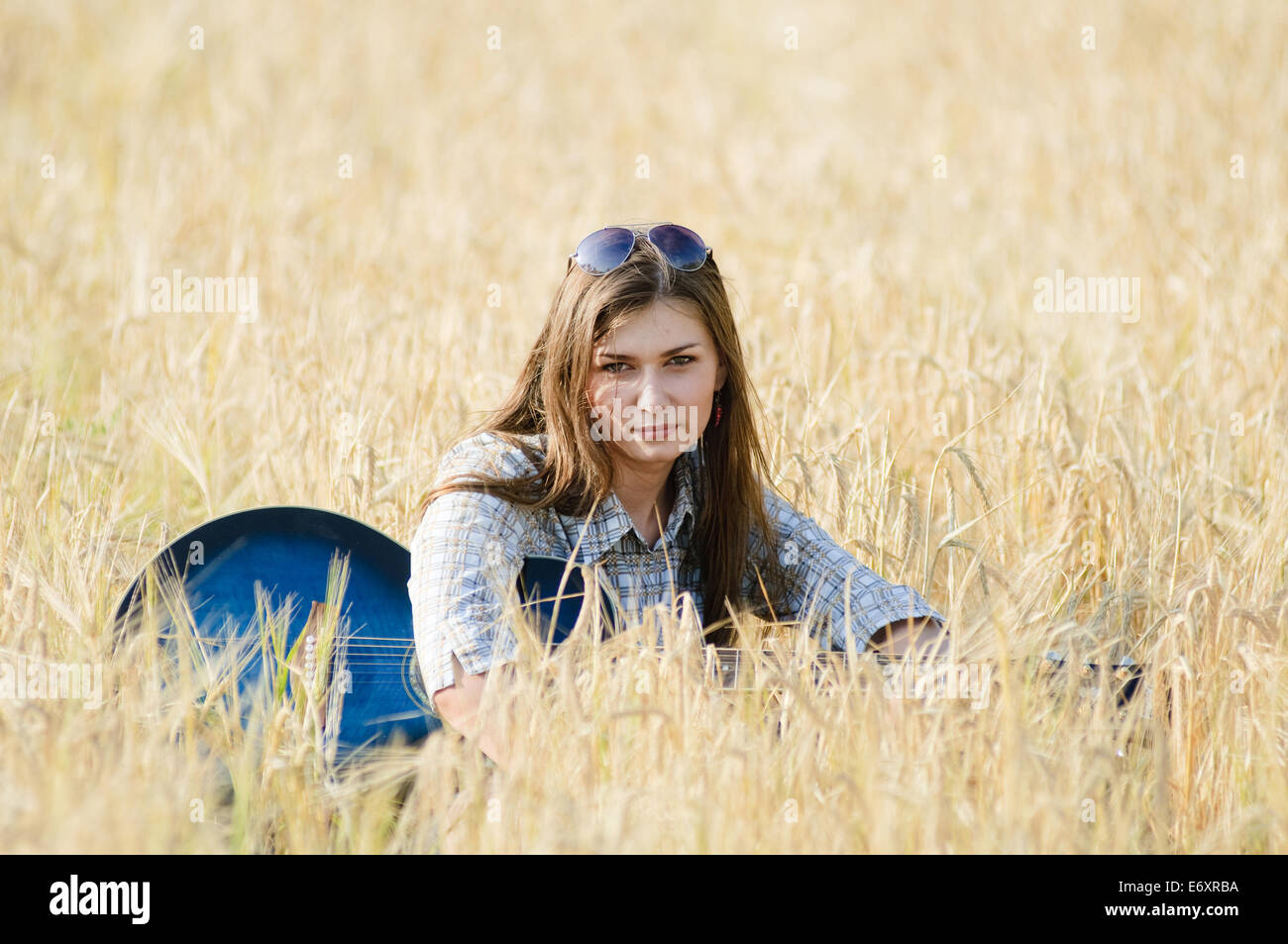 Rocking girl on a nature with guitar Stock Photo - Alamy