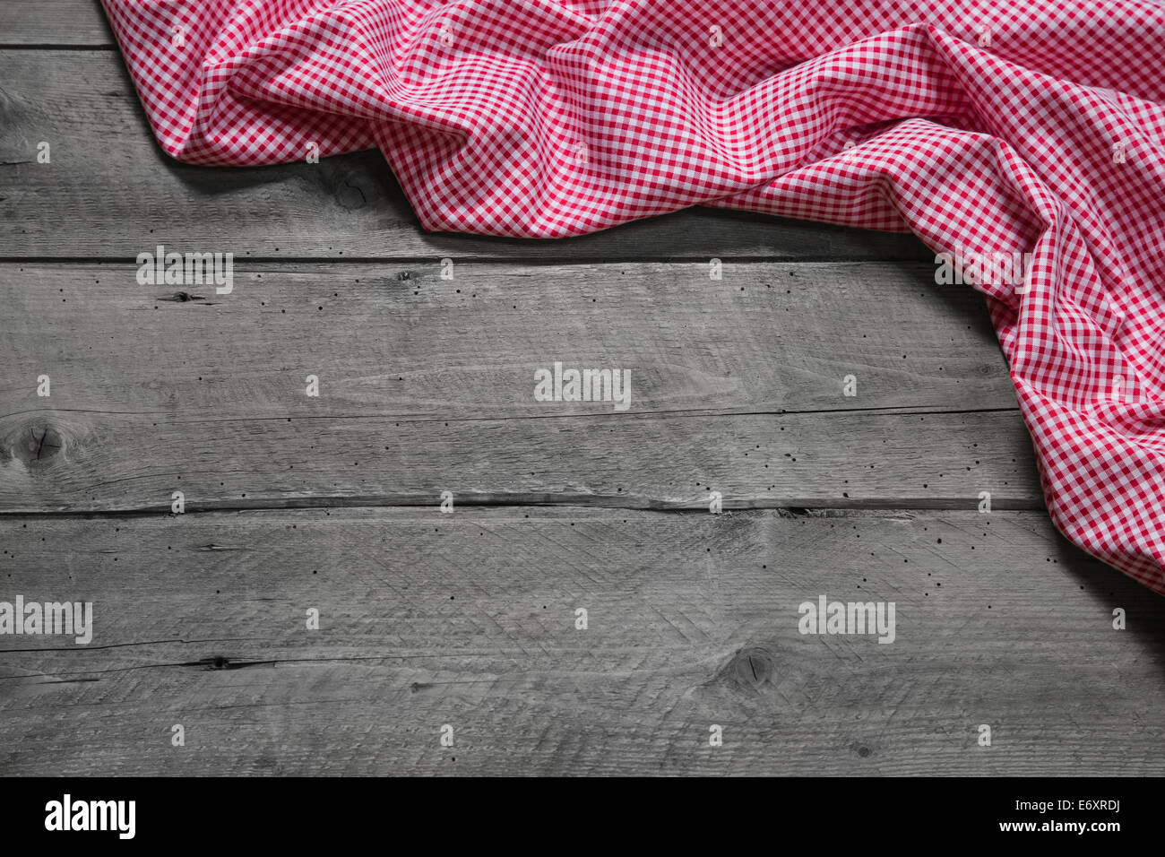 Checkered fabric as border on grey wooden background for christmas ...