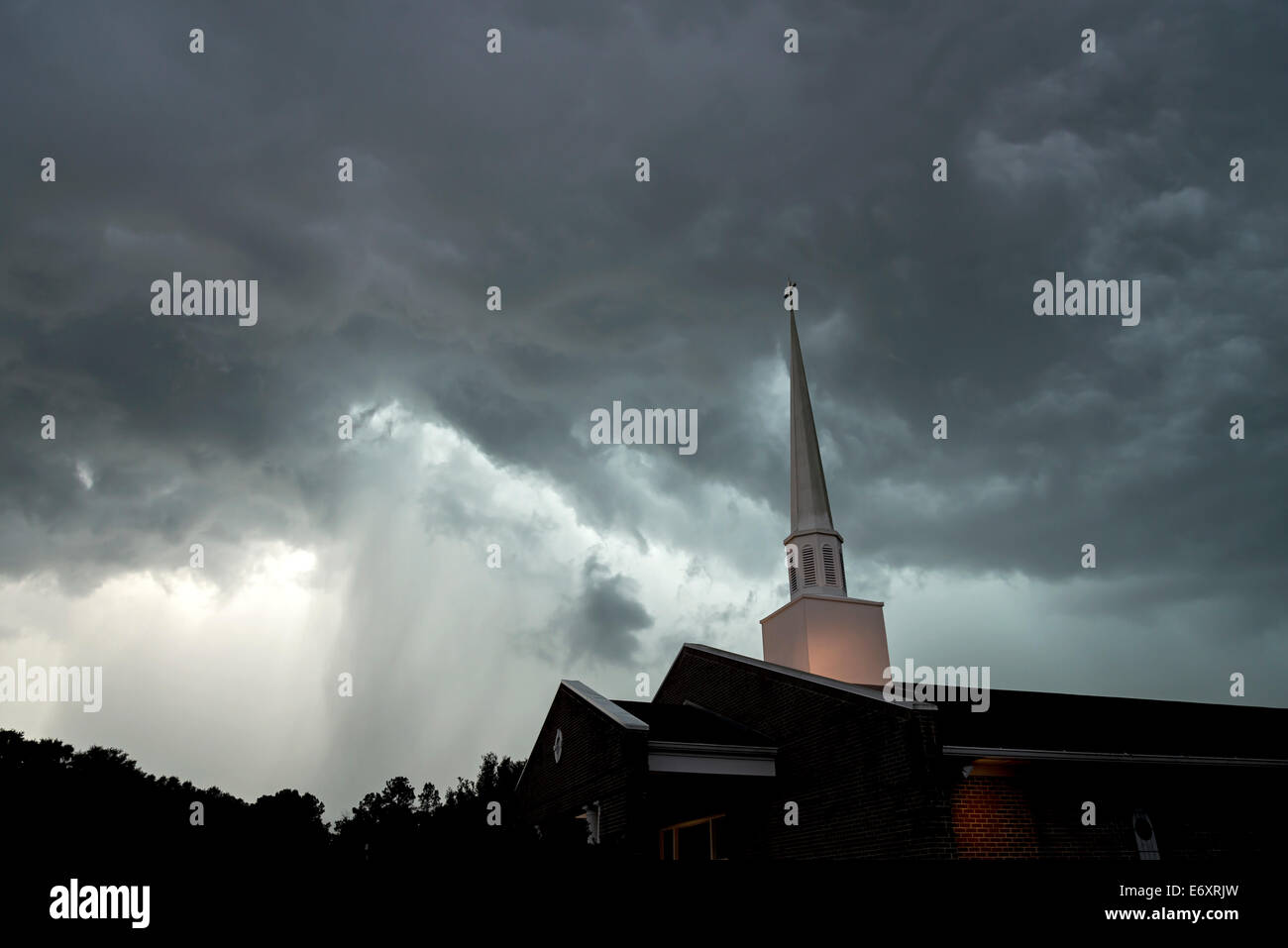 Ominous rain clouds approach a Baptist church in North Florida Stock ...