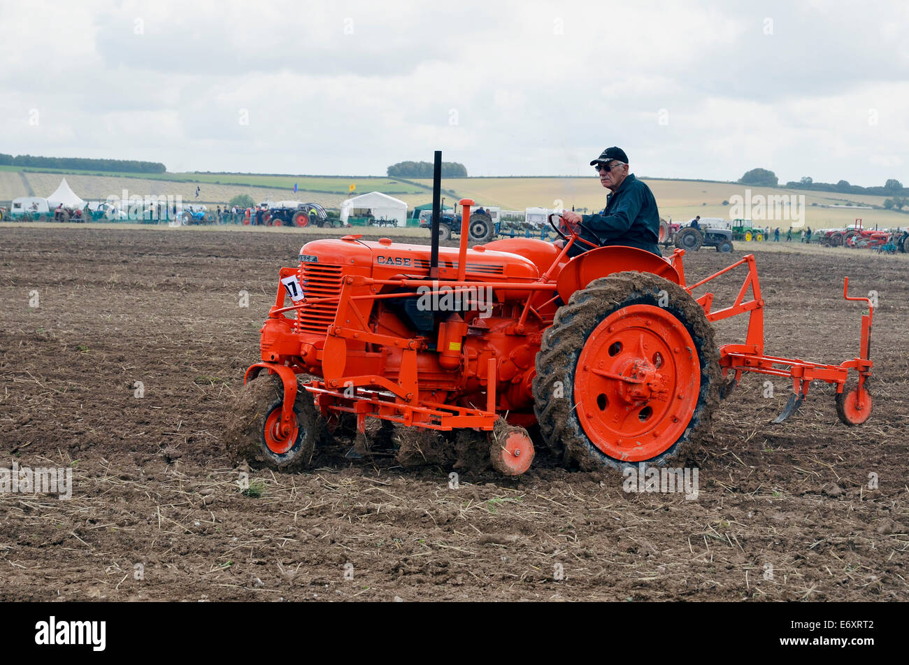 Proud owner demonstrating his Case row crop model tractor (1940's) and ...
