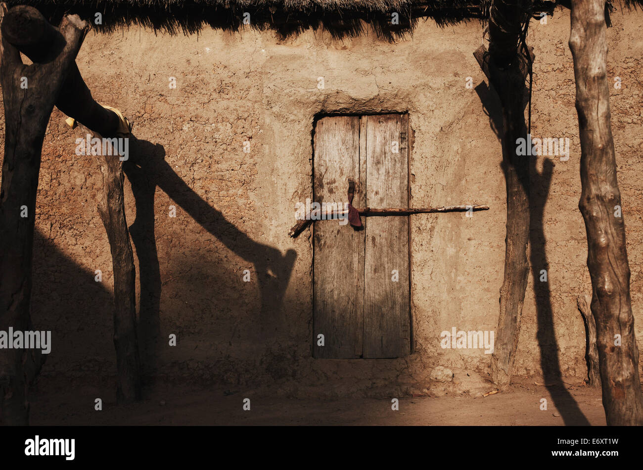Barred door of an adobe hut, Magadala, Mali Stock Photo - Alamy