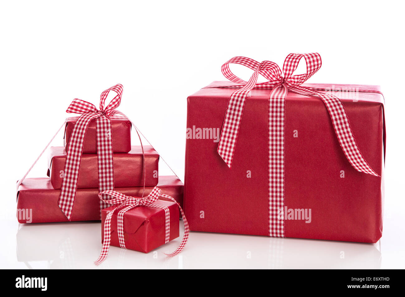 Christmas: stack of red gift boxes with bow and ribbon, isolated on ...