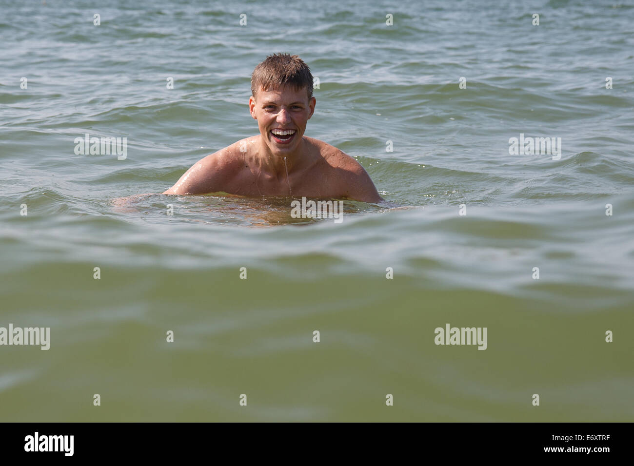 A man in the ocean Stock Photo - Alamy