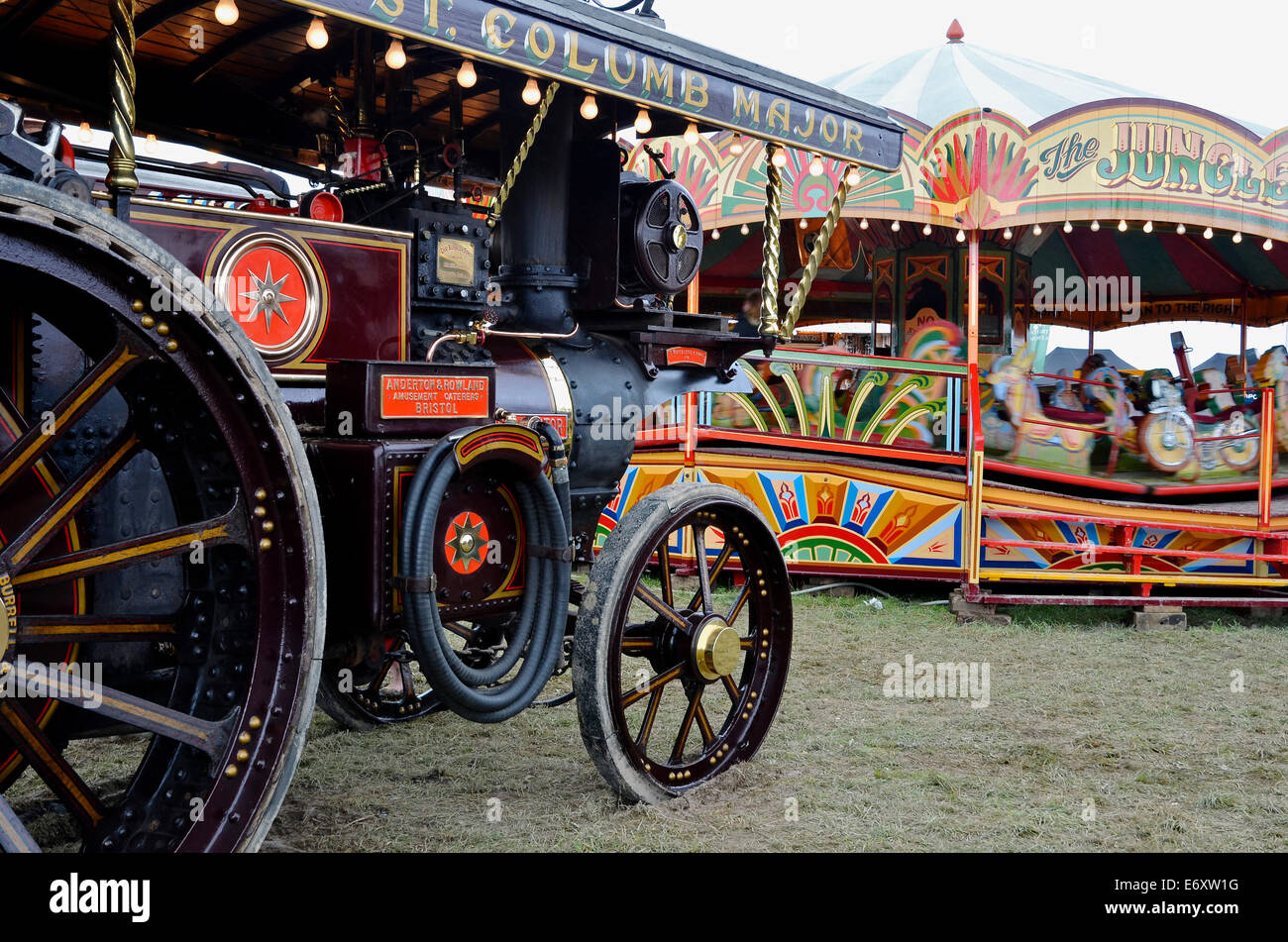 A gleaming showman's engine alongside a traditional fairground ride at ...