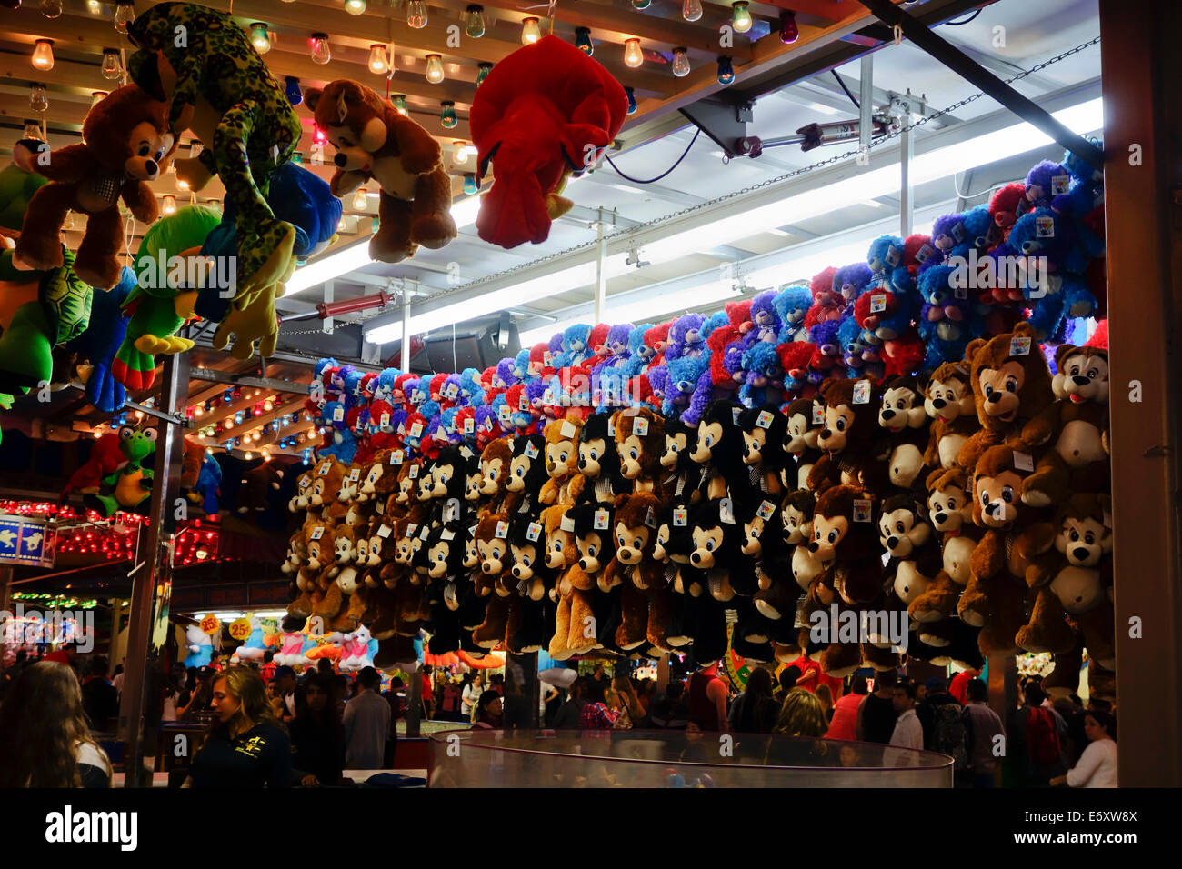 Rows of cute stuffed teddy bears on display as prizes at a games booth ...