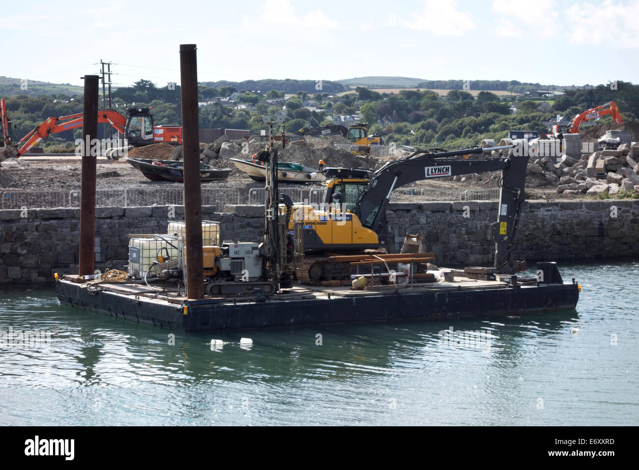 Tracked Excavator On Barge In Hayle Harbour Cornwall UK Stock Photo - Alamy