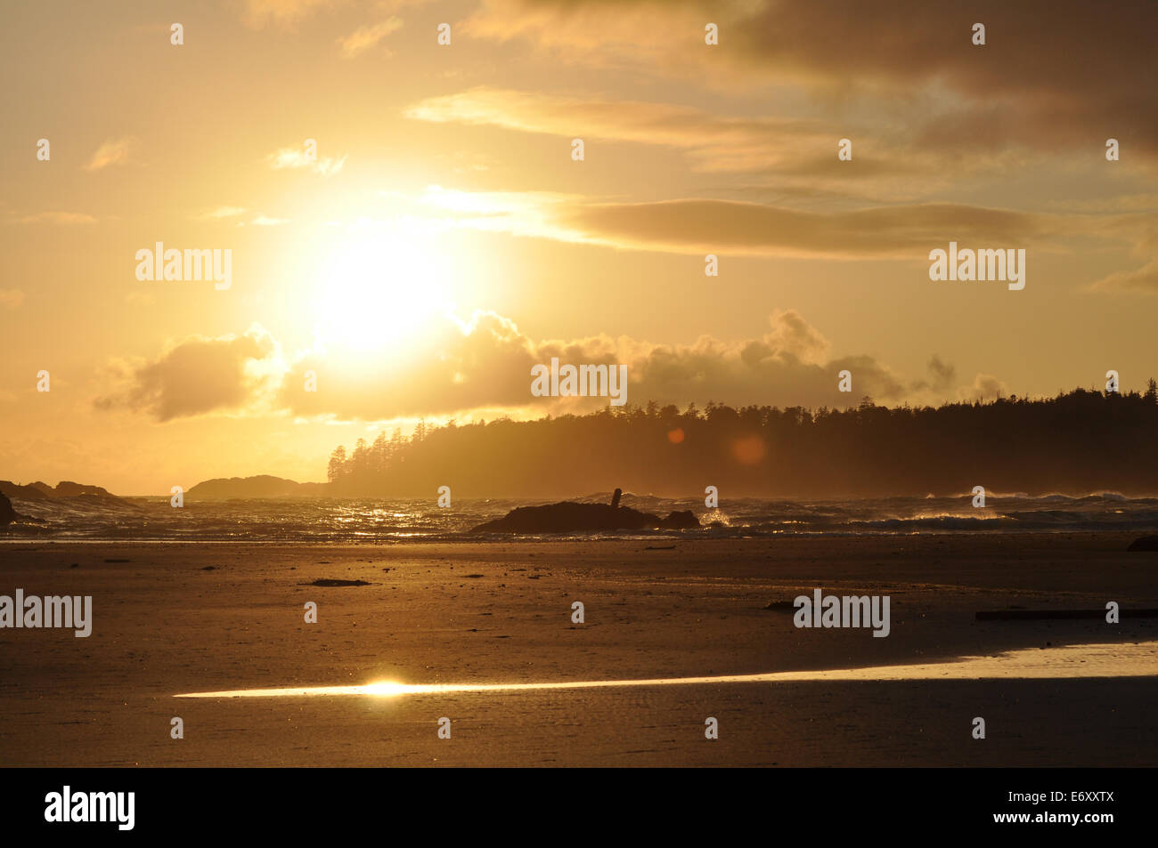 Beach Sunset with reflection and islands Stock Photo - Alamy