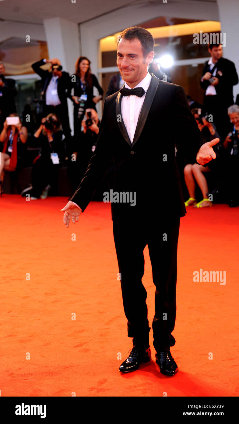 Venice, Italy. 1st Sep, 2014. Actor Elio Germano poses on the red ...