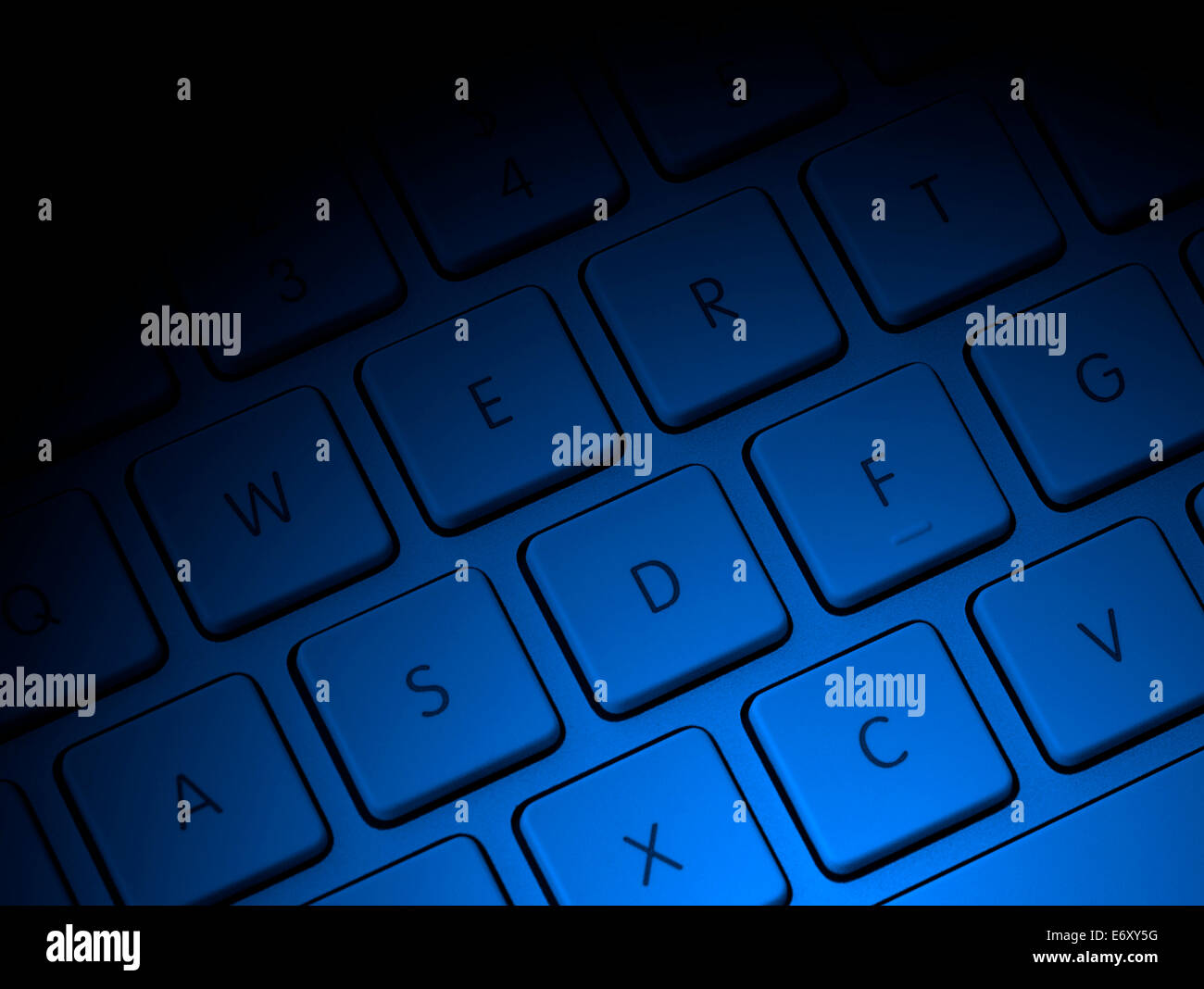 Closeup of computer keys with blue lighting for effect Stock Photo - Alamy