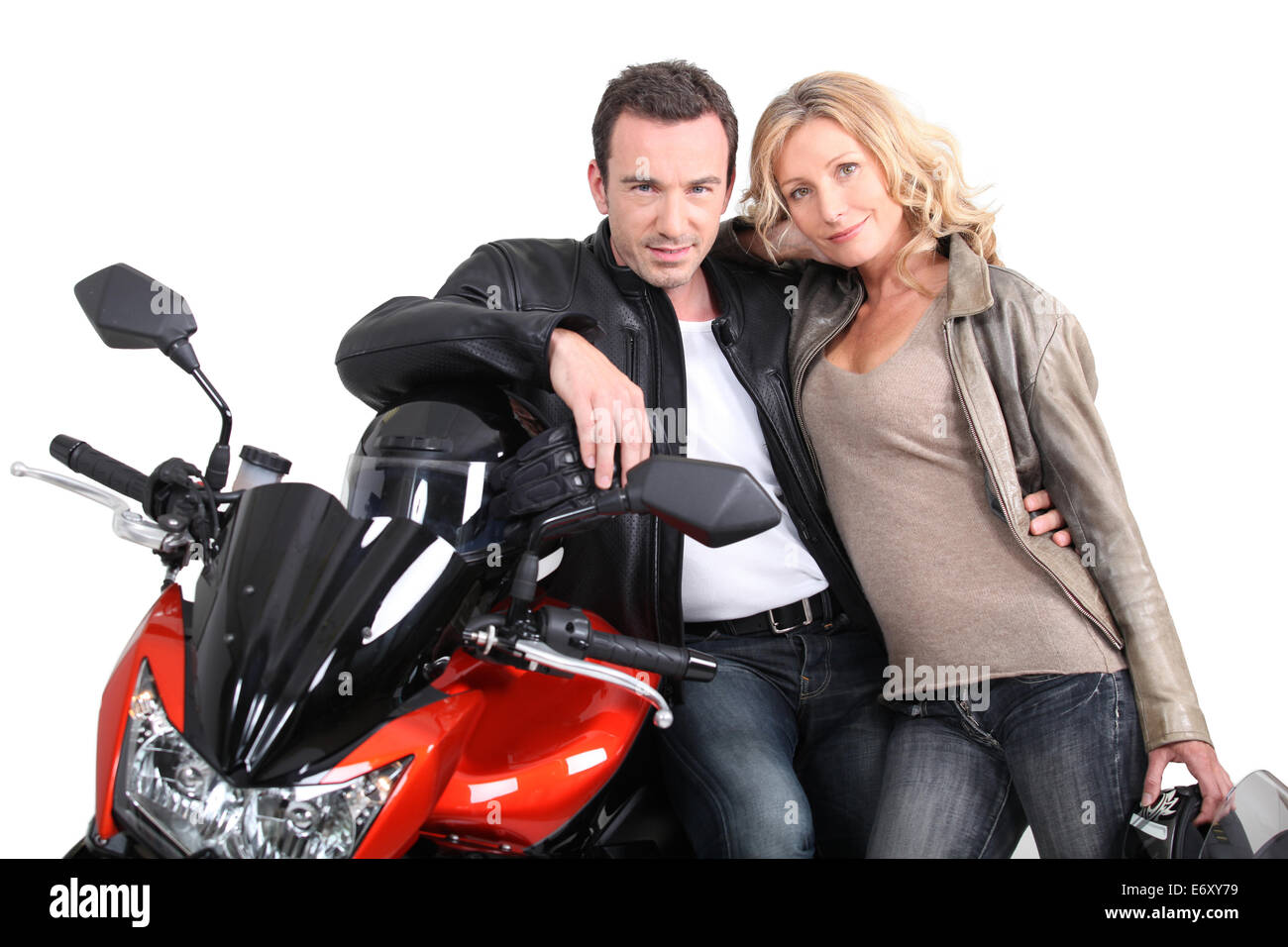 Biker chic leaning on biker's shoulder Stock Photo - Alamy