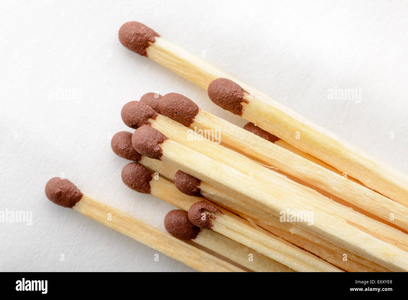 Close-up of matches on white paper background Stock Photo - Alamy