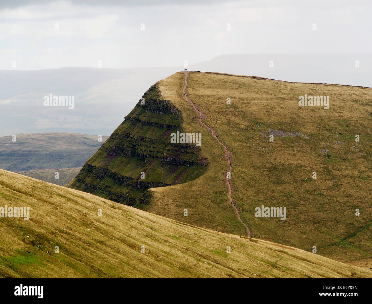 Hill walking on the Brecon Beacons.Walkers in the distance on the path ...
