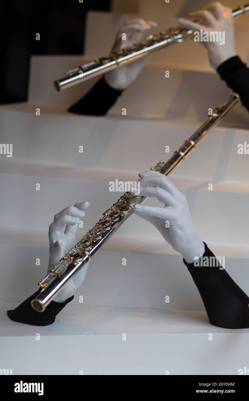 Shop window Display Hands playing a Flute Stock Photo - Alamy