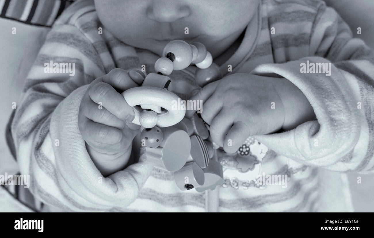 Child chewing hands hi-res stock photography and images - Alamy