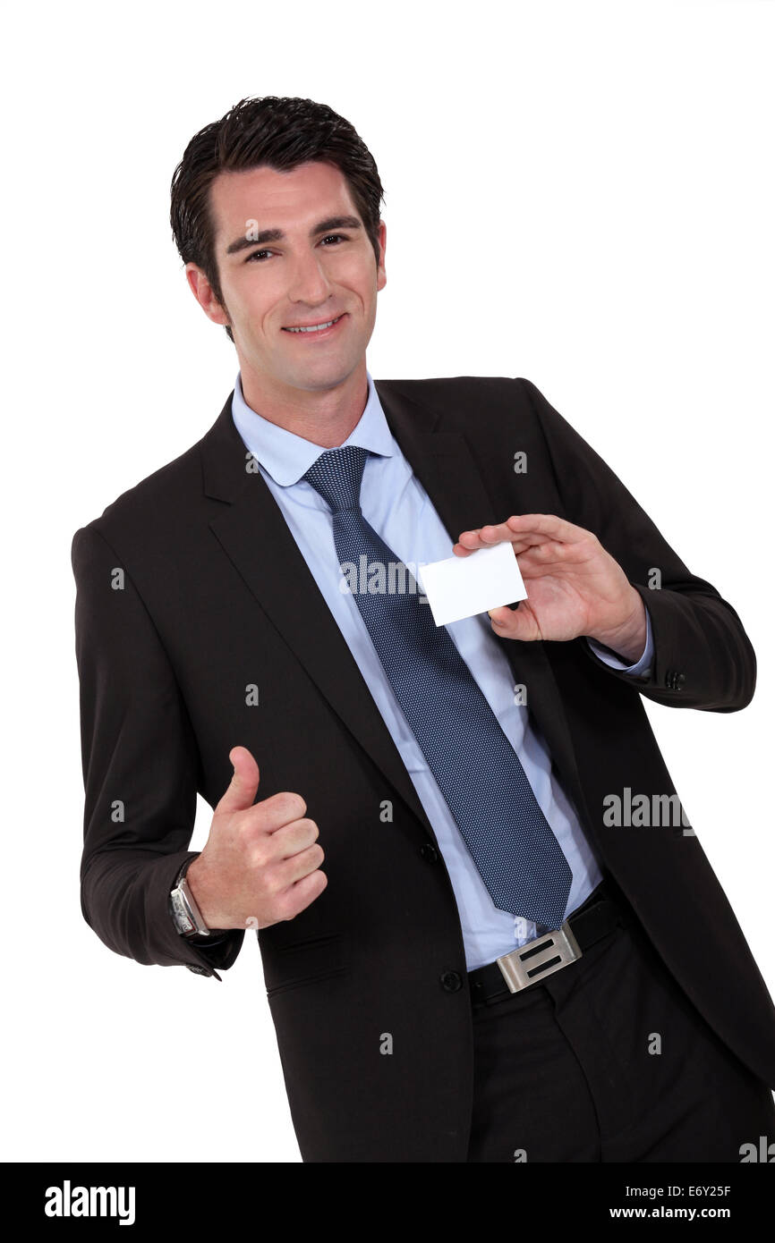 Businessman showing card Stock Photo - Alamy