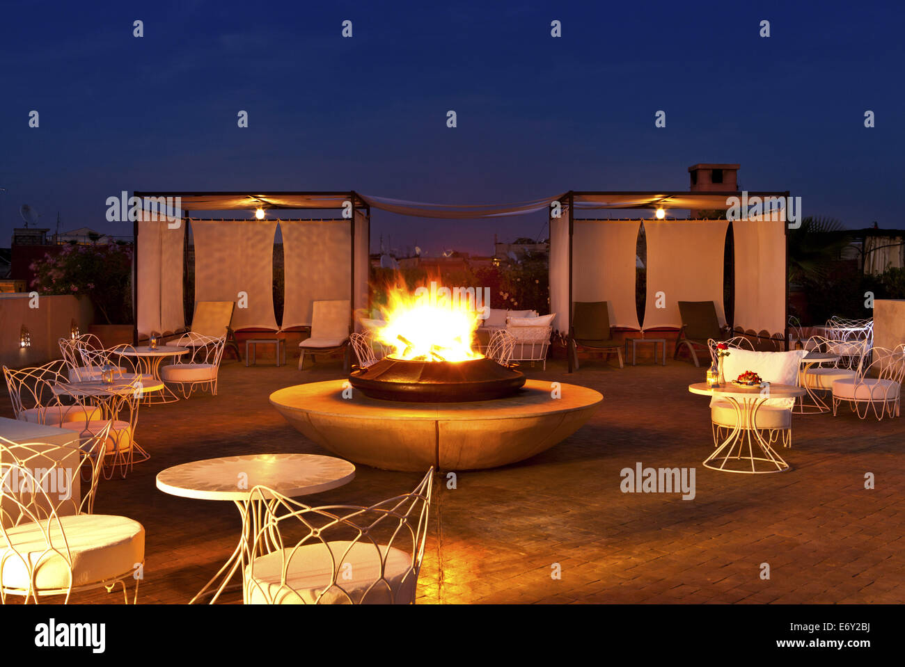 Rooftop terrace with fireplace, Riad Nashira, Marrakech, Morocco Stock ...