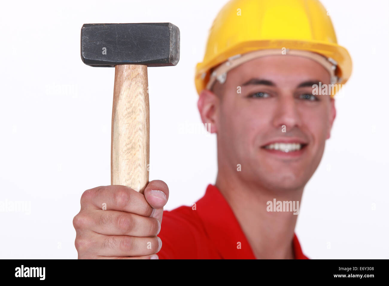 Mason with lump mallet Stock Photo - Alamy