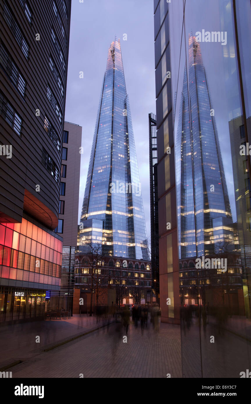 The Shard reflecting in the windows of the modern office buildings of ...
