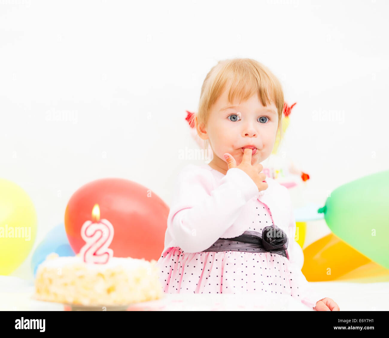 Little girl celebrating second birthday Stock Photo - Alamy