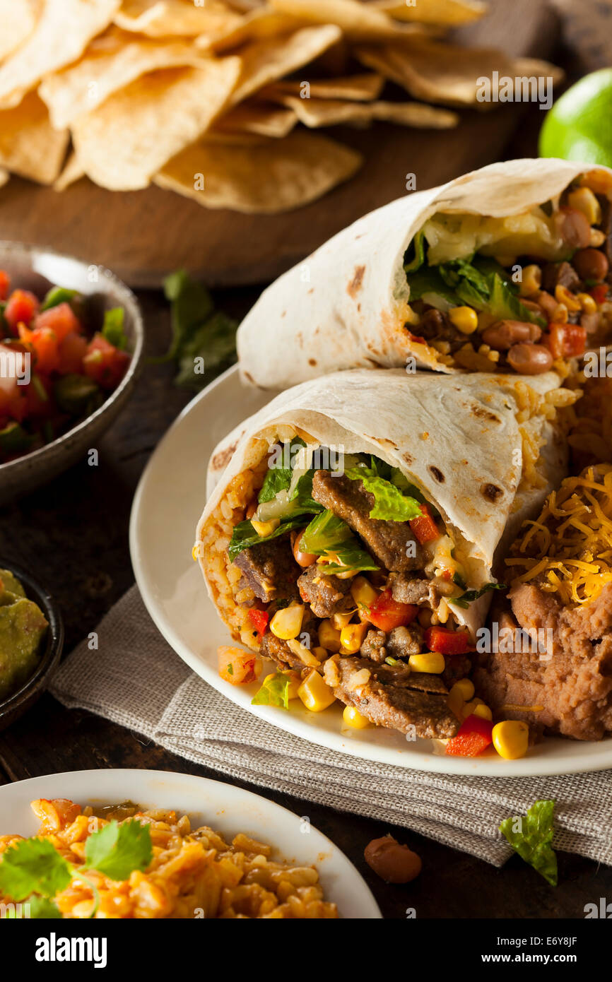 Homemade Giant Beef Burrito with Lettuce Salsa and Rice Stock Photo - Alamy