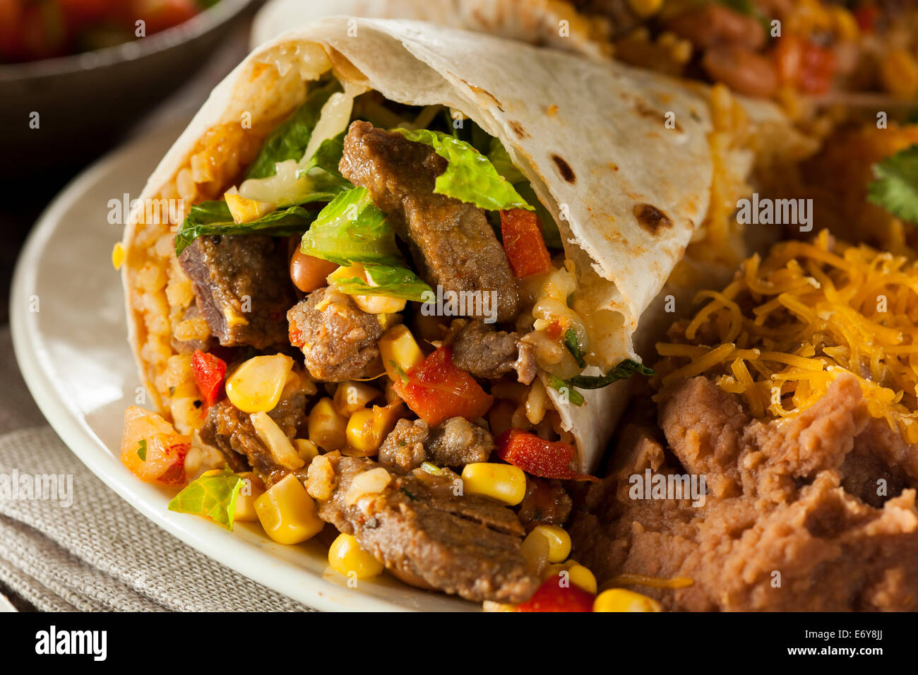 Homemade Giant Beef Burrito with Lettuce Salsa and Rice Stock Photo - Alamy