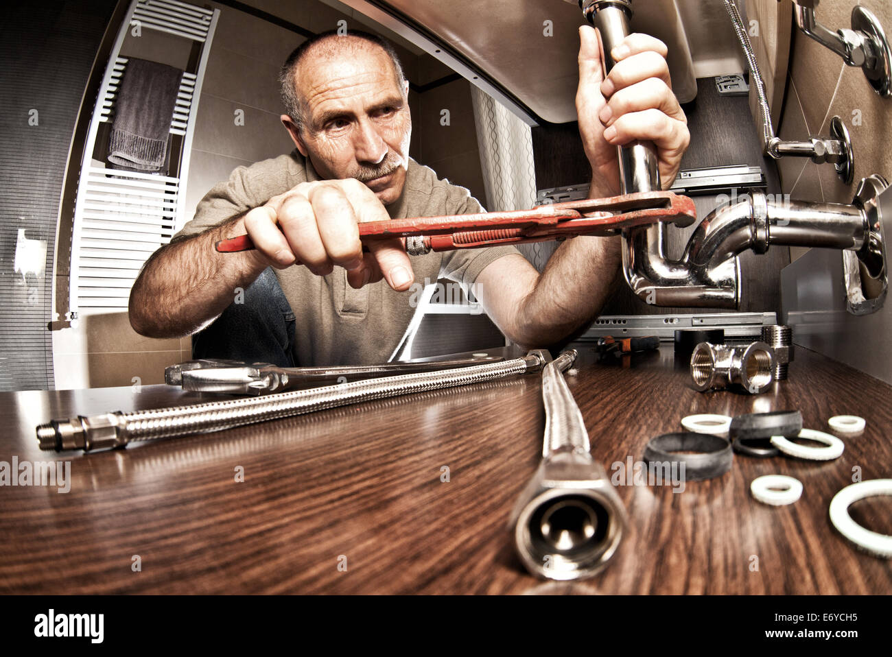 portrait of senior plumber at work Stock Photo - Alamy