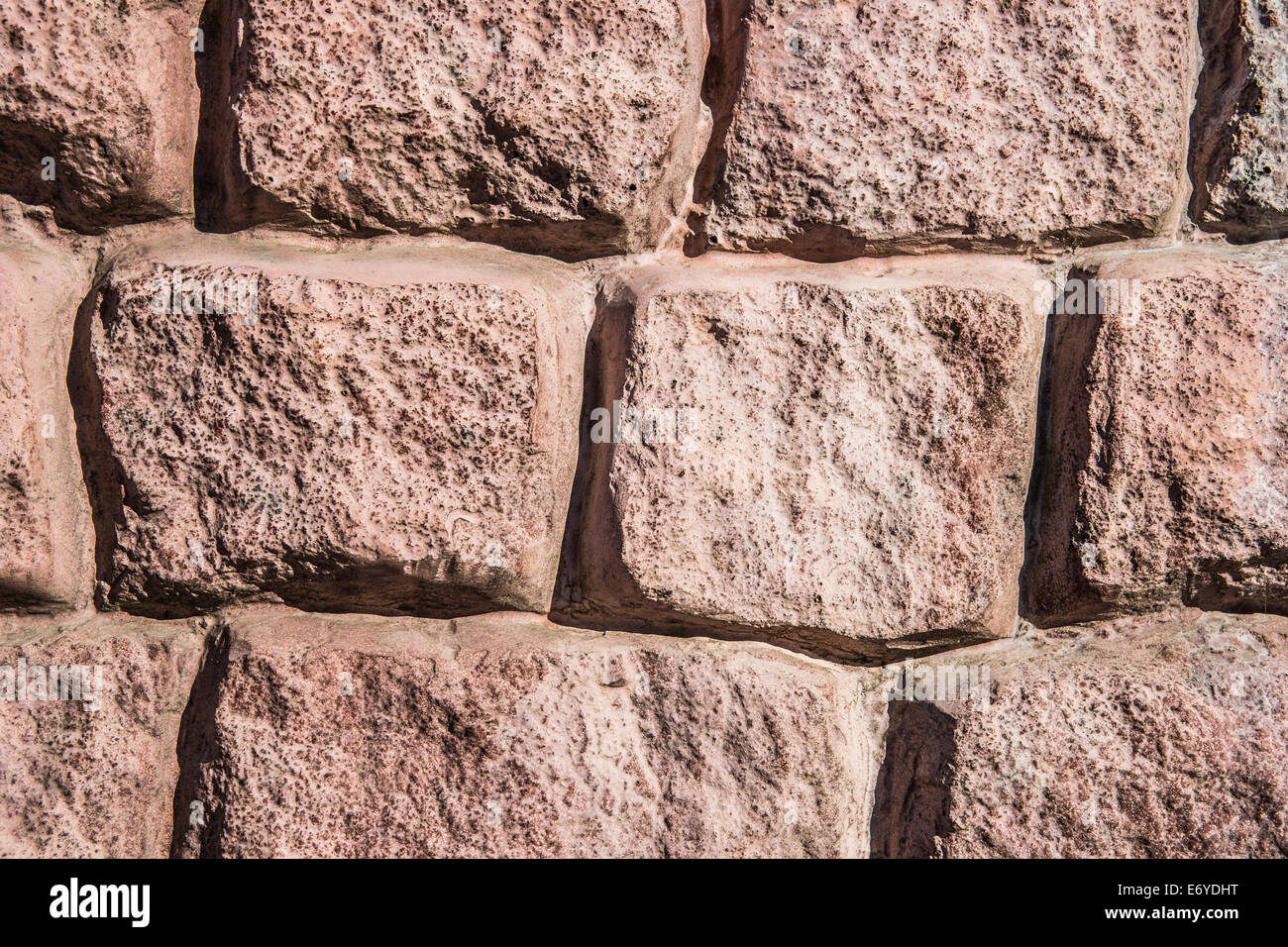Closeup view of decorative stone wall of brown color Stock Photo - Alamy