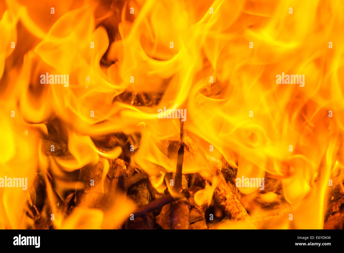 Orange and yellow bonfire flames and burning firewood Stock Photo - Alamy